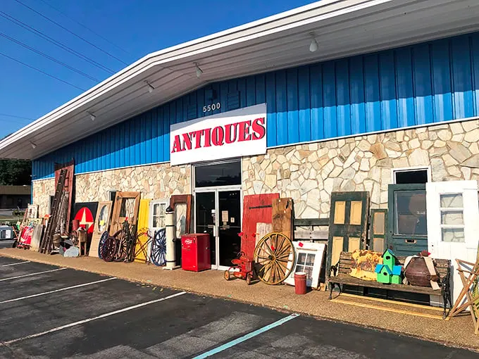 The blue facade with its bold "ANTIQUES" sign isn't just a storefront—it's a portal to decades past waiting to be explored.