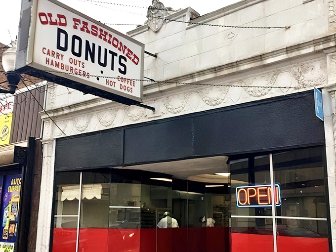 The vintage sign says it all – donuts, carry-outs, hamburgers, hot dogs. In Chicago's Roseland neighborhood, this isn't just breakfast; it's an institution.