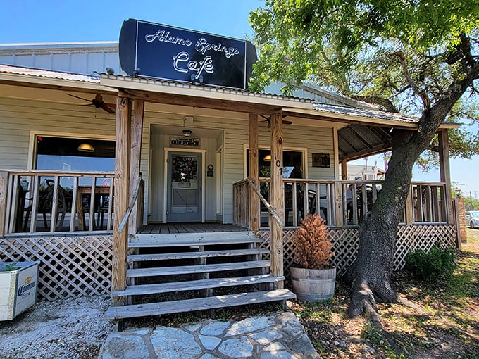 The humble exterior of Alamo Springs Café belies the culinary treasures within. Texas Hill Country magic awaits on this rustic patio.