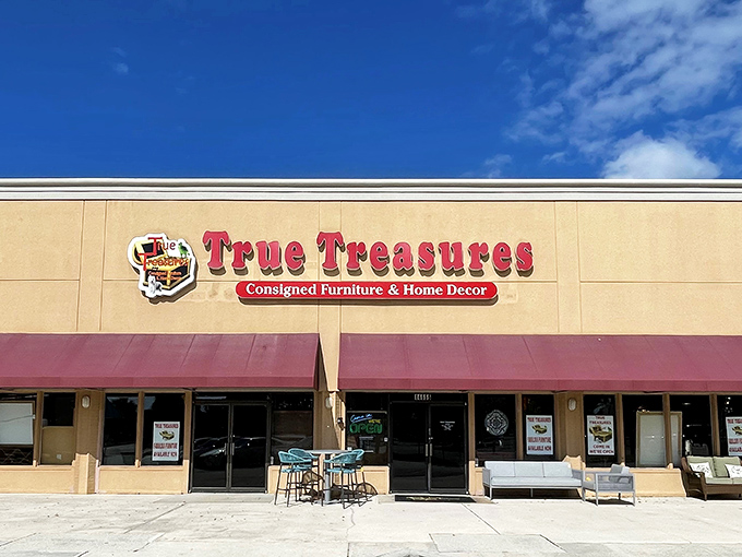 The storefront beckons with its bold red signage and burgundy awnings—like a treasure chest waiting to be opened in the Florida sunshine.