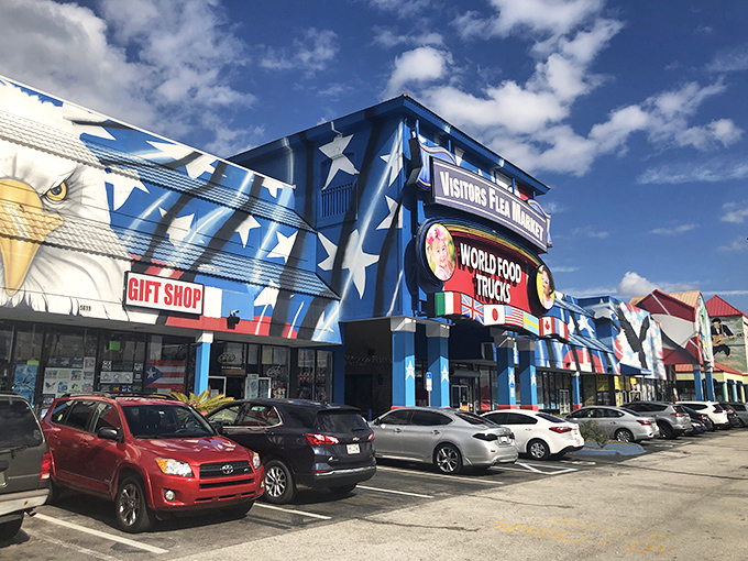 The patriotic blue facade of Visitors Flea Market stands out like a beacon for bargain hunters on Highway 192. Stars, stripes, and shopping paradise!
