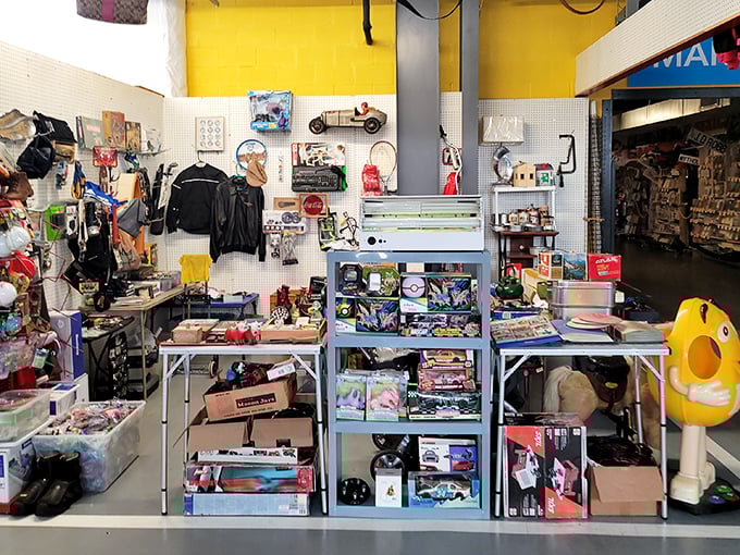 Wide, spotless corridors lead to adventure at Caesar Creek Flea Market, where yellow directional signs promise "MORE VENDORS" – the two most beautiful words in the English language.