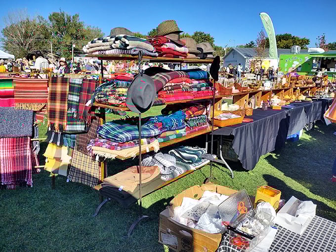 Colorful wool blankets and textiles stack high at this vendor's booth, a rainbow-hued treasure trove that would make even Marie Kondo reconsider her minimalism.