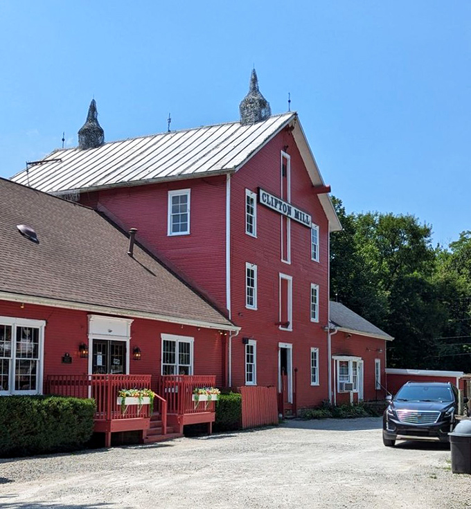 The iconic red mill perched above cascading waterfalls isn't just Instagram bait—it's a 200-year-old testament to when breakfast came with a side of history.