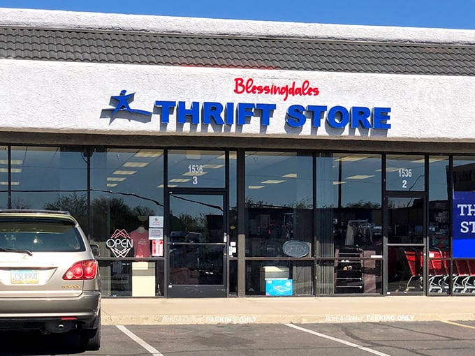 The bright blue and red signage of Blessingdales beckons like a retail oasis in the desert, promising treasures within that Nordstrom shoppers pay ten times more for.