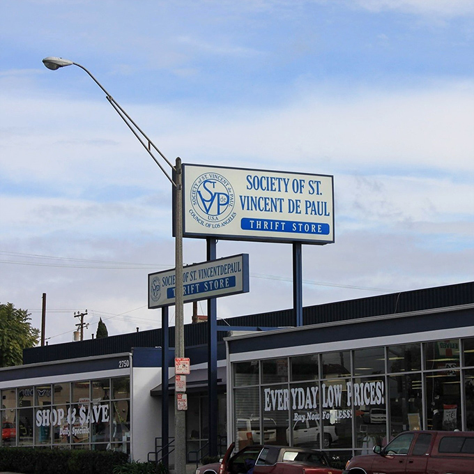 The blue and white storefront promises "Shop & Save" – not just a slogan but a sacred covenant between you and your wallet.
