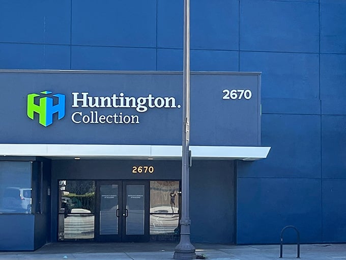 The blue exterior of Huntington Collection stands like a vault of treasures, its unassuming façade hiding the wonderland of bargains within.