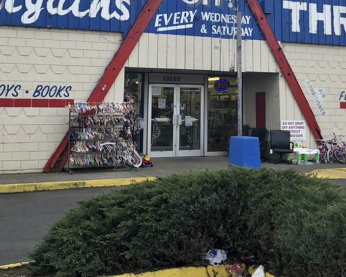 The blue and red exterior of Better Bargains stands like a retail mullet—business in the front, bargain party all around. Baby strollers await their next adventure.