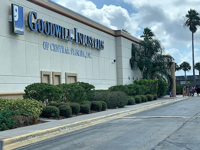 The retail equivalent of finding a $20 bill in your winter coat pocket—Goodwill on Orange Blossom Trail stands ready for treasure hunters under Florida's brilliant blue sky.