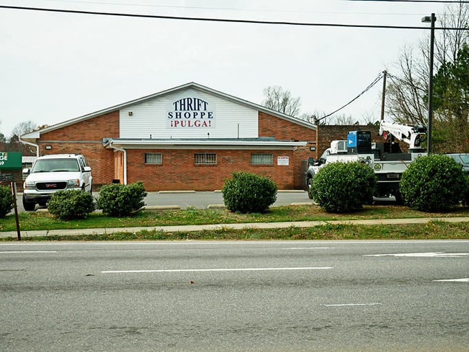 The unassuming brick exterior hides a treasure trove within. Like finding a secret passage in your childhood home, this thrift store promises adventures beyond its modest façade.