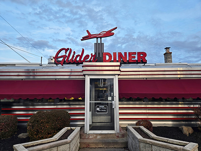 The iconic red glider airplane perched atop this classic Scranton diner isn't just decoration—it's a beacon calling hungry travelers home to comfort food paradise.