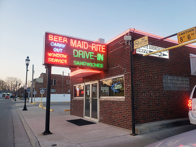 That neon sign doesn't lie – this brick beauty promises sandwich perfection and delivers beyond your wildest dreams.