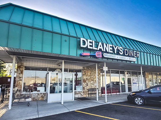 That teal roof isn't just eye-catching—it's a beacon for hungry souls. Delaney's stone facade promises comfort before you even step inside.