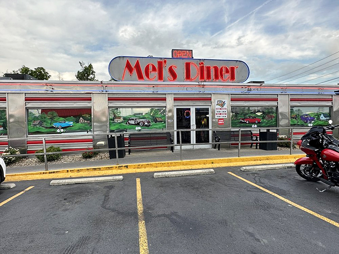 That iconic silver exterior with the glowing red sign isn't just inviting you to eat – it's inviting you to time travel to simpler days.