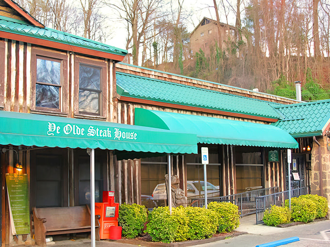 The stone pillars and rustic wooden facade aren't just for show—they're the gateway to one of Knoxville's most beloved culinary time machines.
