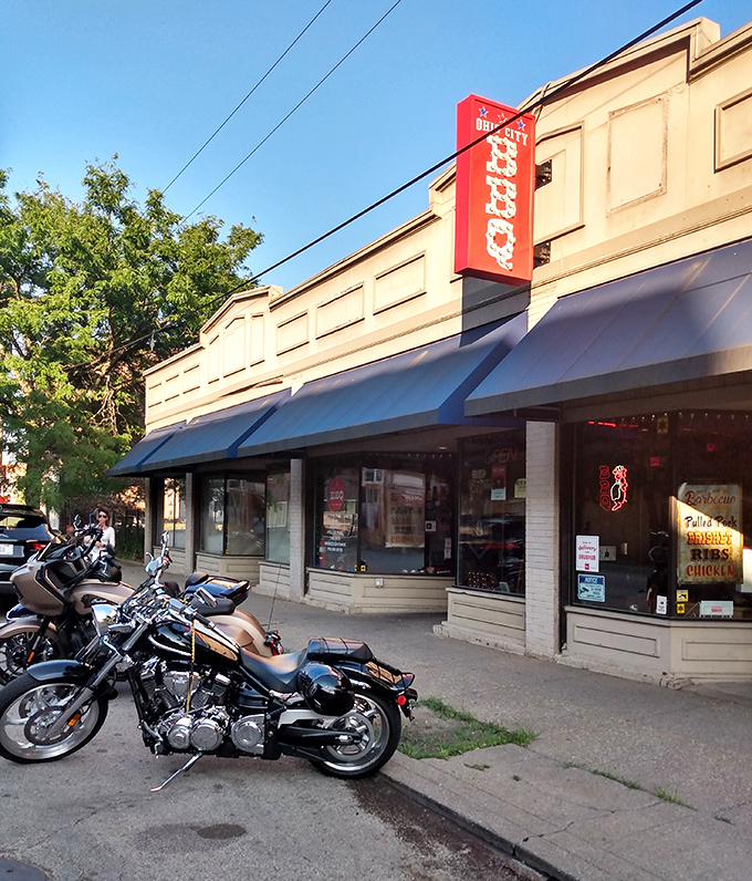 The unassuming exterior of Real Smoq'ed BBQ gives no hint of the flavor explosion waiting inside. Blue awnings and a simple storefront hide Cleveland's best-kept barbecue secret.