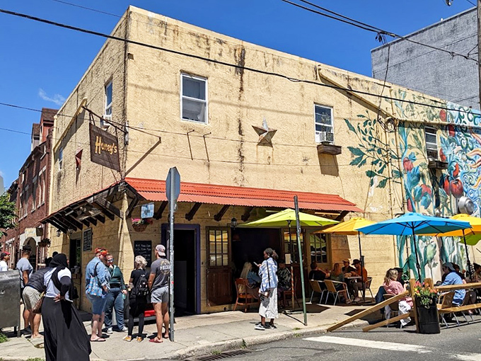 The unassuming exterior of Honey's Sit 'n Eat hides culinary treasures within. That line of hungry patrons? They know what you're about to discover.