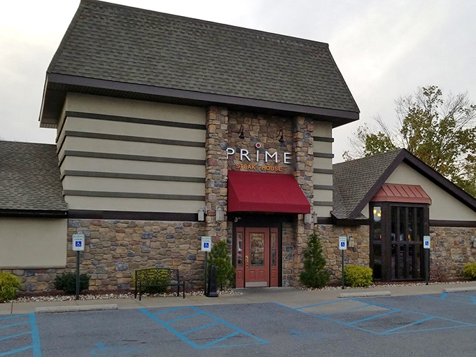 The stone facade of Prime Steak House welcomes hungry travelers with its distinctive red awning—like a beacon of culinary promise in Bethlehem's dining landscape.