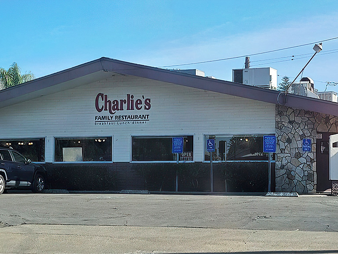 Charlie's iconic exterior stands as a time capsule of classic Americana dining, complete with stone façade and vintage signage.