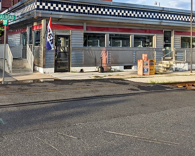 The classic checkerboard trim and stainless steel exterior of Lincoln Diner stands as a beacon of comfort food in historic Gettysburg.