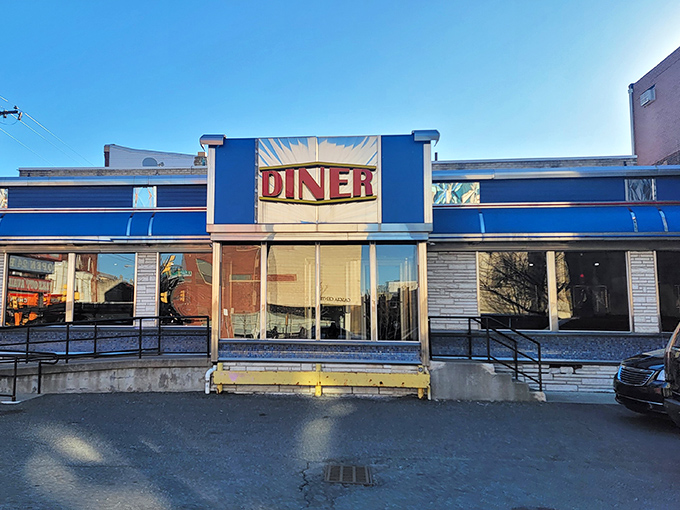 The iconic blue exterior of Broad Street Diner stands as a beacon of breakfast hope on Philadelphia's bustling thoroughfare, promising comfort food and nostalgia in equal measure.
