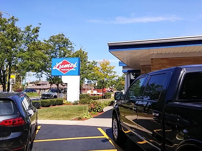The blue-trimmed exterior of Lumes stands like a beacon of breakfast hope, promising pancake perfection before you even step inside.