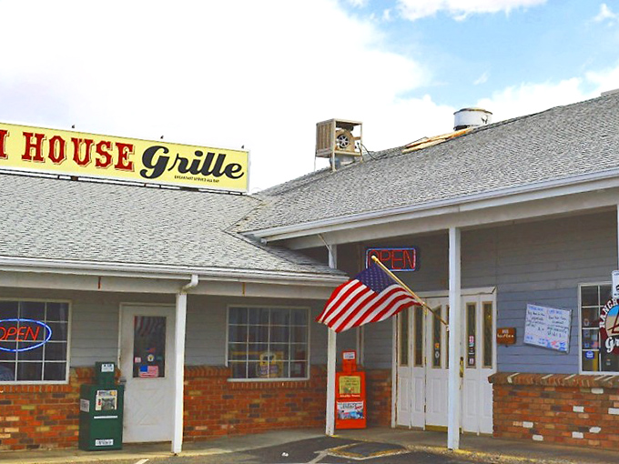 The American flag waves a hearty welcome outside Ranch House Grille, where breakfast dreams come true beneath that unassuming Arizona sky.