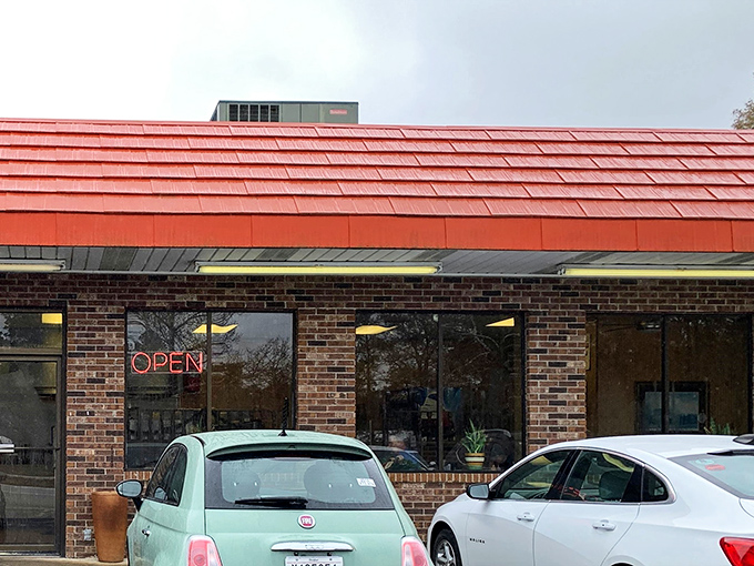 That iconic red roof and brick exterior isn't trying to be fancy—and that's precisely its charm. A beacon for hungry travelers since long before Instagram food pics were a thing.