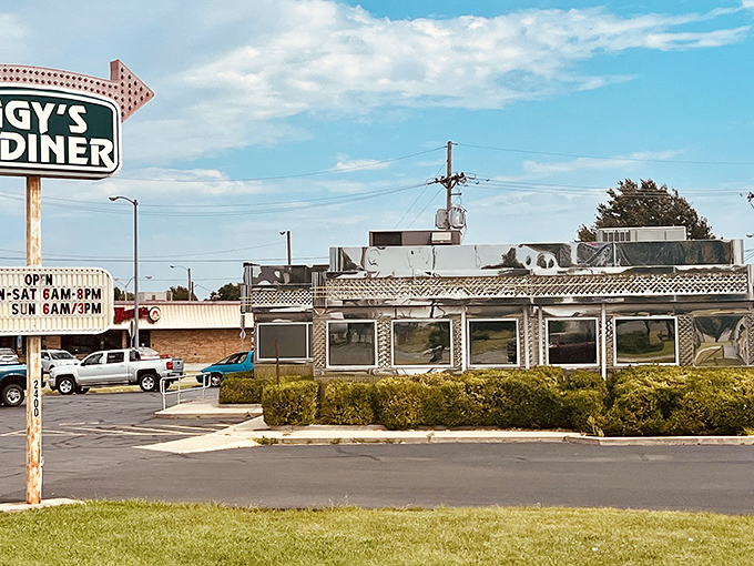 The gleaming stainless steel exterior of Iggy's Diner shines like a time capsule from 1955, beckoning hungry travelers with its vintage Route 66 charm.