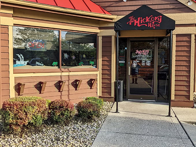 The Hickory House's distinctive brown exterior with its bright red roof stands like a beacon of comfort food promise in Reynoldsburg.