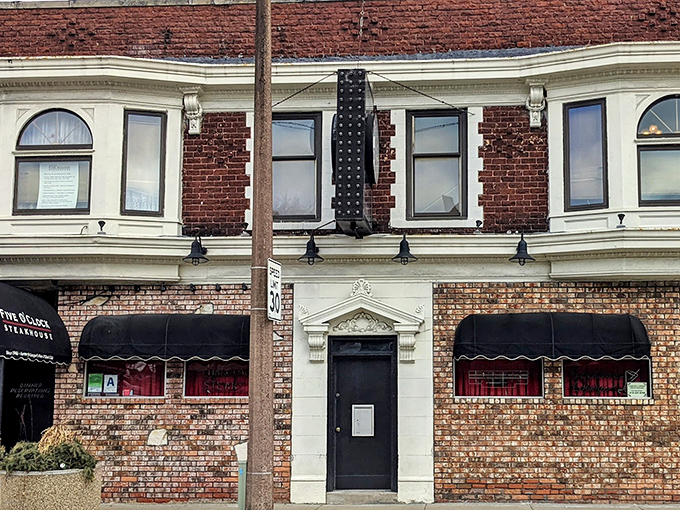 The unassuming brick exterior of Five O'Clock Steakhouse hides Milwaukee's carnivorous paradise like a secret handshake among meat lovers.