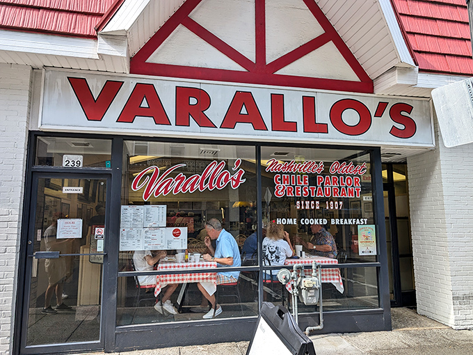 The iconic red-roofed Varallo's stands like a time capsule amid downtown Nashville's modern skyline—a culinary landmark that's outlasted countless music trends.