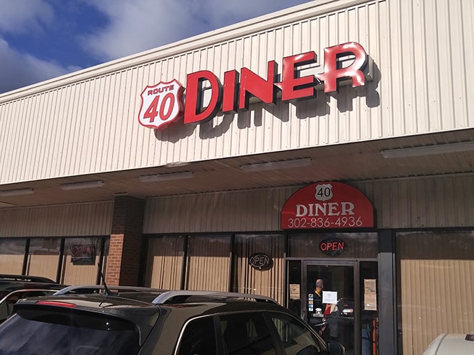 The bright red Route 40 Diner sign beckons hungry travelers like a lighthouse for the breakfast-starved. Classic Americana at its finest.
