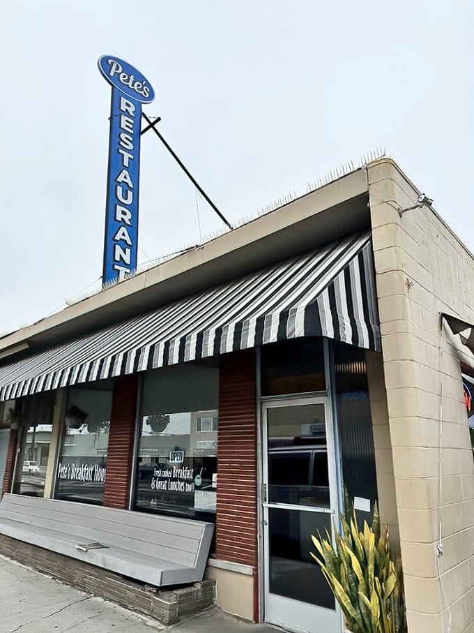 The iconic Pete's Breakfast House sign stands tall against the California sky, a beacon of breakfast hope for hungry travelers on East Main Street.