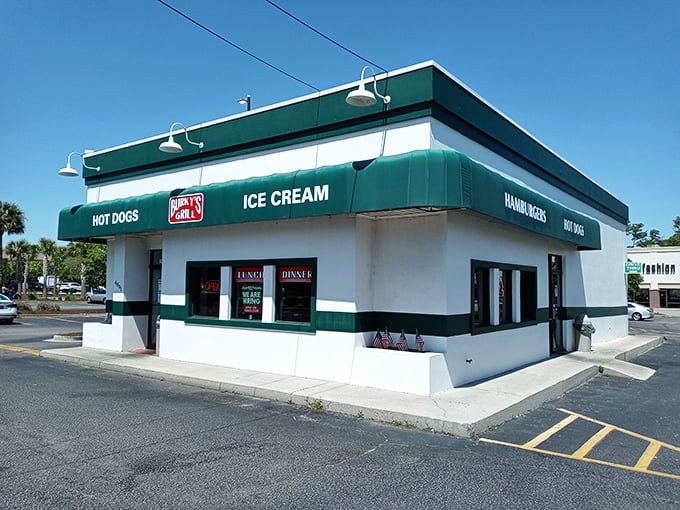 The teal and white façade of Burky's Grill stands proudly under Carolina blue skies, a mid-century monument to America's love affair with the burger.