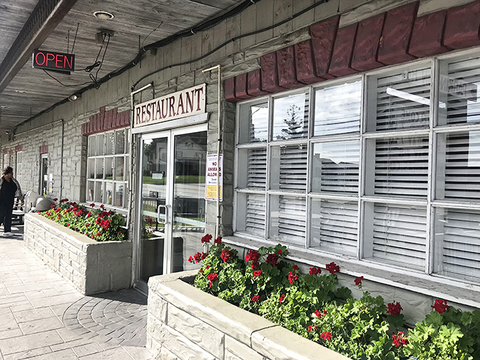 The unassuming exterior of Dienner's Country Restaurant beckons hungry travelers with its simple charm and promise of authentic Amish cooking that's worth the journey.