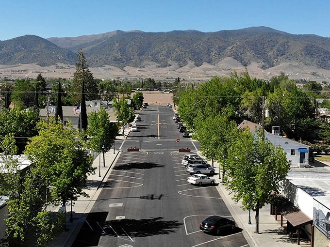 Tree-lined streets frame Tehachapi's majestic mountains, where the air is cleaner and nobody's rushing to sit in traffic.