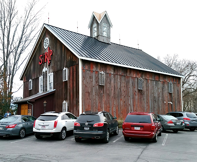 The rustic barn exterior of Strip Steakhouse stands as a delicious contradiction—fine dining hiding in plain sight among Avon's countryside charm.