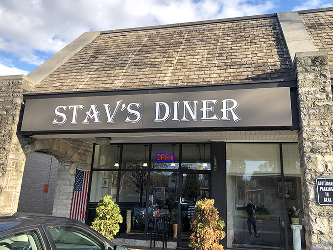 The modest stone façade of Stav's Diner hides Columbus's breakfast holy grail. That glowing "OPEN" sign might as well say "PARADISE FOUND."