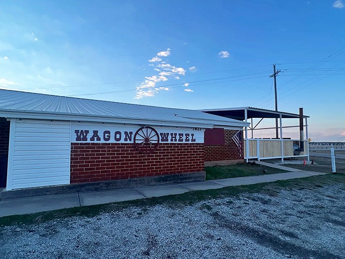 The unassuming exterior of Wagon Wheel Dance Hall stands like a culinary speakeasy—only those in the know realize what smoky treasures await inside.