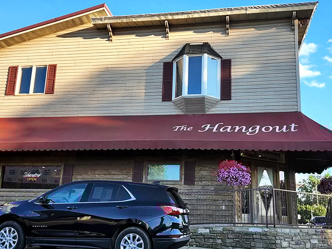 The unassuming exterior of The Hangout in Danville hides culinary treasures within. Small-town charm with big-time flavor awaits behind that red awning.