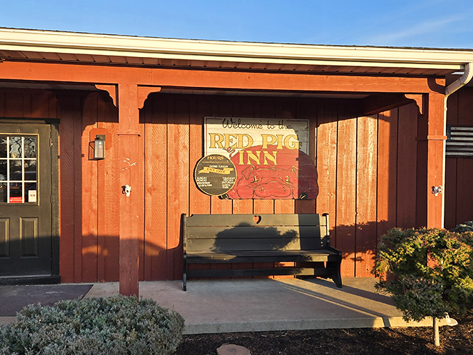 The rustic wooden exterior of Red Pig Inn welcomes hungry travelers like an old friend who happens to make killer barbecue.