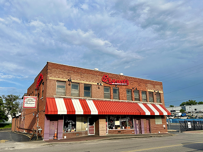 That iconic red script against brick isn't just a sign—it's a beacon calling barbecue pilgrims to one of Kansas City's most hallowed smoke temples.