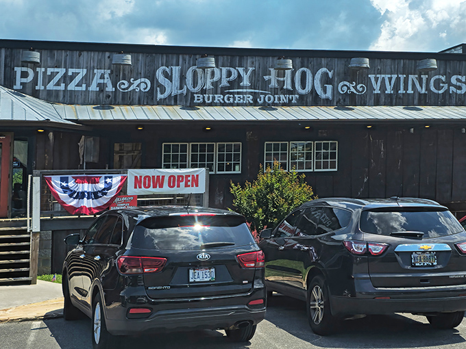 The rustic wooden facade of Sloppy Hog promises exactly what you want in a roadside find—authenticity without pretension and flavors worth the journey.