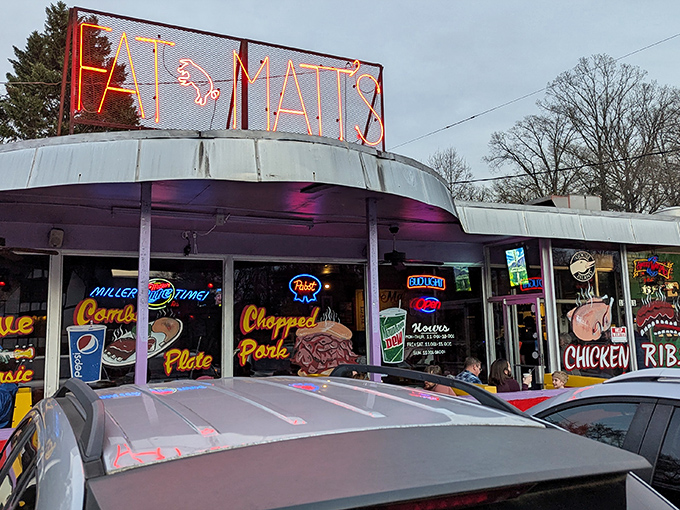 That neon sign isn't just a logo—it's Atlanta's bat signal for barbecue lovers. Fat Matt's glows like a beacon of smoky promise.