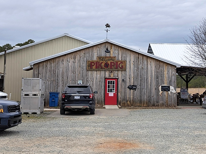 The weathered wooden exterior with that iconic red door isn't just inviting—it's practically whispering "get in here and eat something amazing."