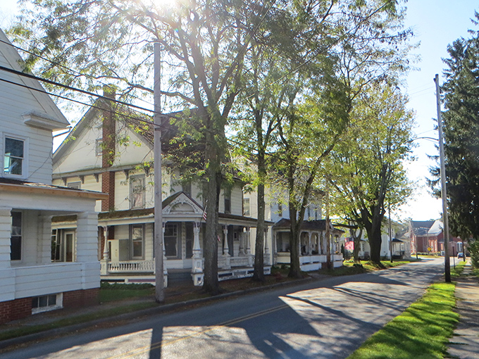 Tree-lined streets where Victorian homes stand like proud grandparents sharing stories with younger neighbors.