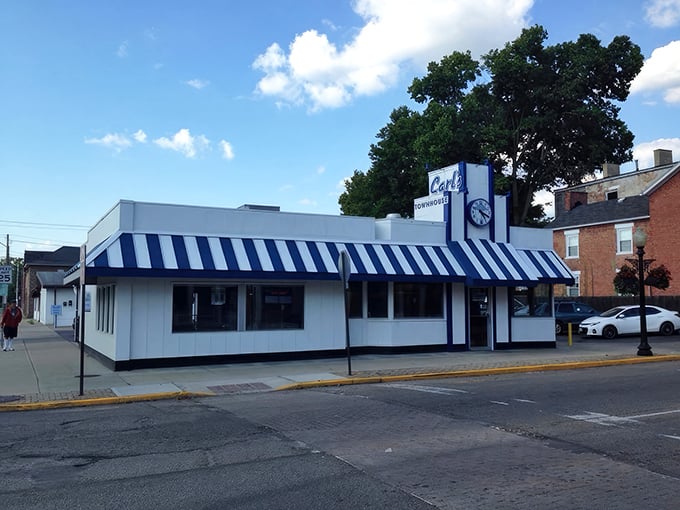 The blue and white striped awning of Carl's Townhouse stands out like a beacon of breakfast hope in downtown Chillicothe, promising delicious nostalgia inside.