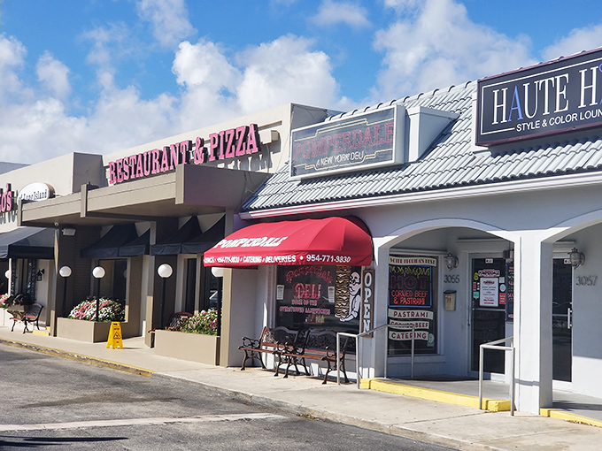 Don't let the modest storefront fool you—behind that red awning lies a temple of sandwich artistry that would make Manhattan jealous.