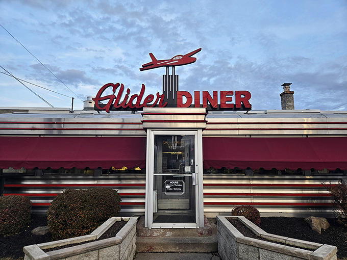 The iconic red glider plane perched atop this classic Scranton diner isn't just decoration—it's a beacon calling hungry travelers home to comfort food paradise.